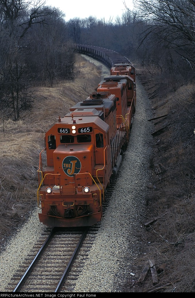 EJ&E 665 is northbound with ore empties at Route 19